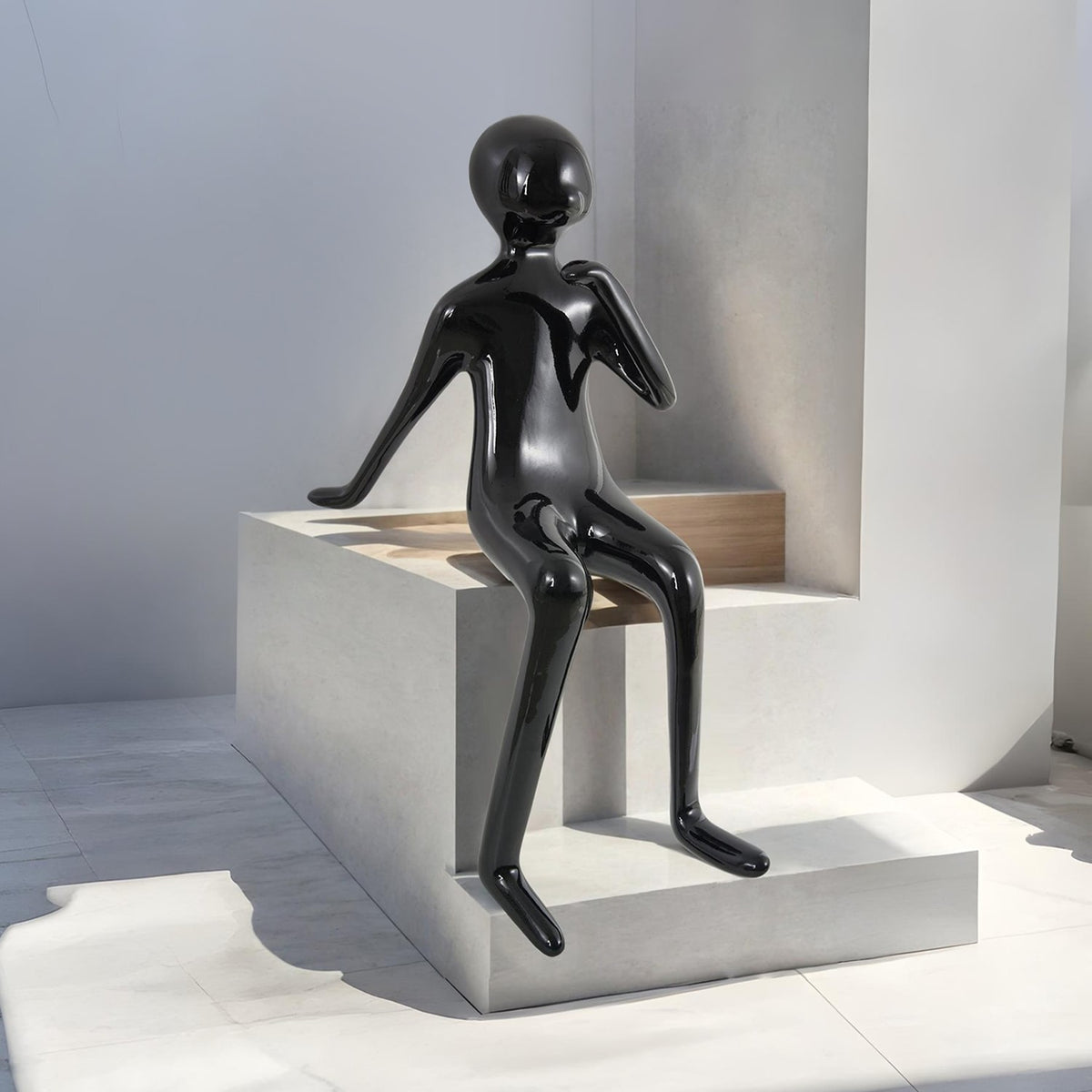 Urban Thinker– Glossy Black Resin Seated Figure Sculpture – Finesse Decor